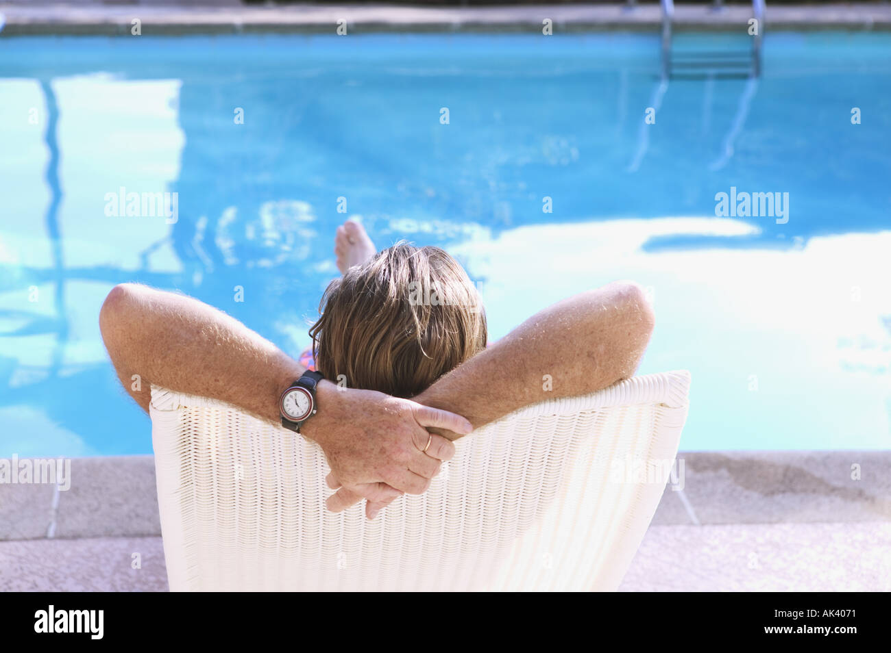 Man chilling in swimming pool hi-res stock photography and images - Alamy