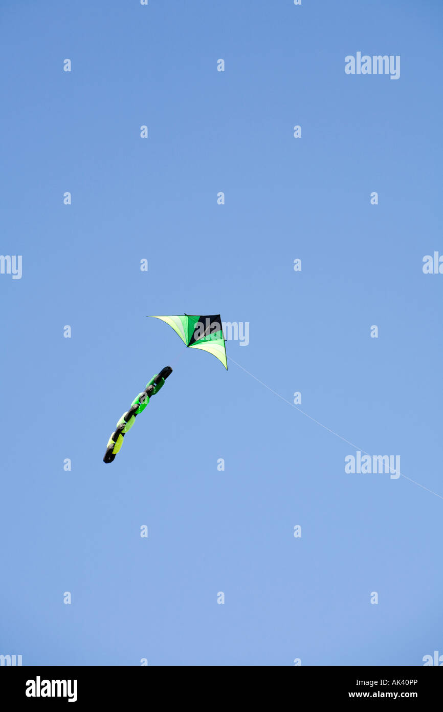 kite flying high in a blue sky Stock Photo - Alamy