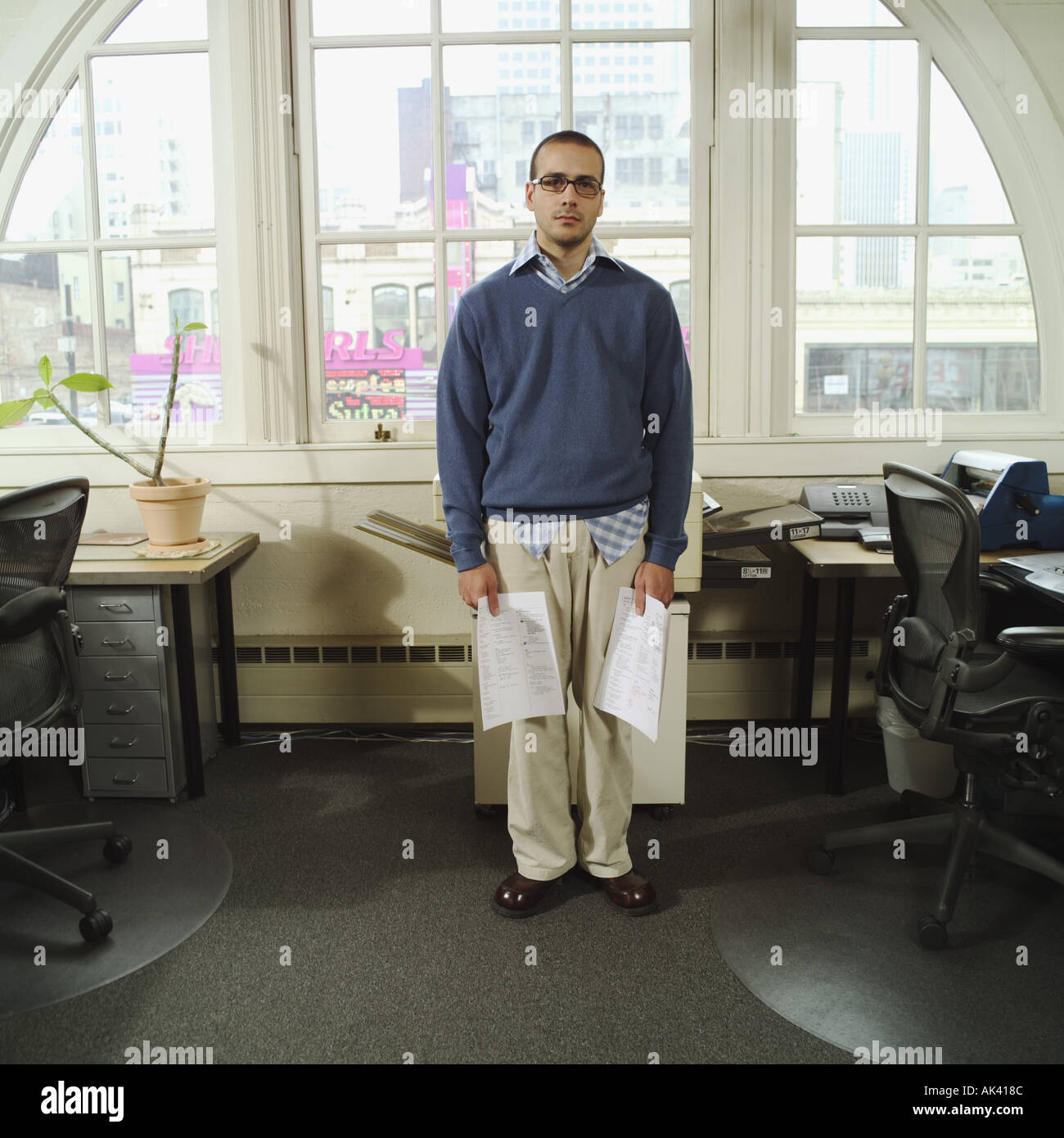 A sad man in front of a copy machine Stock Photo - Alamy