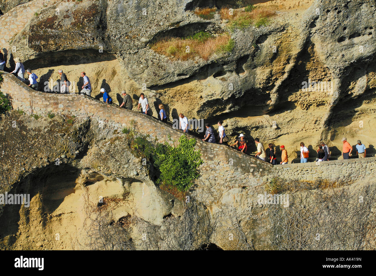 tourists climbing to the monastery of Megalo Meteoro Meteora Greece ...
