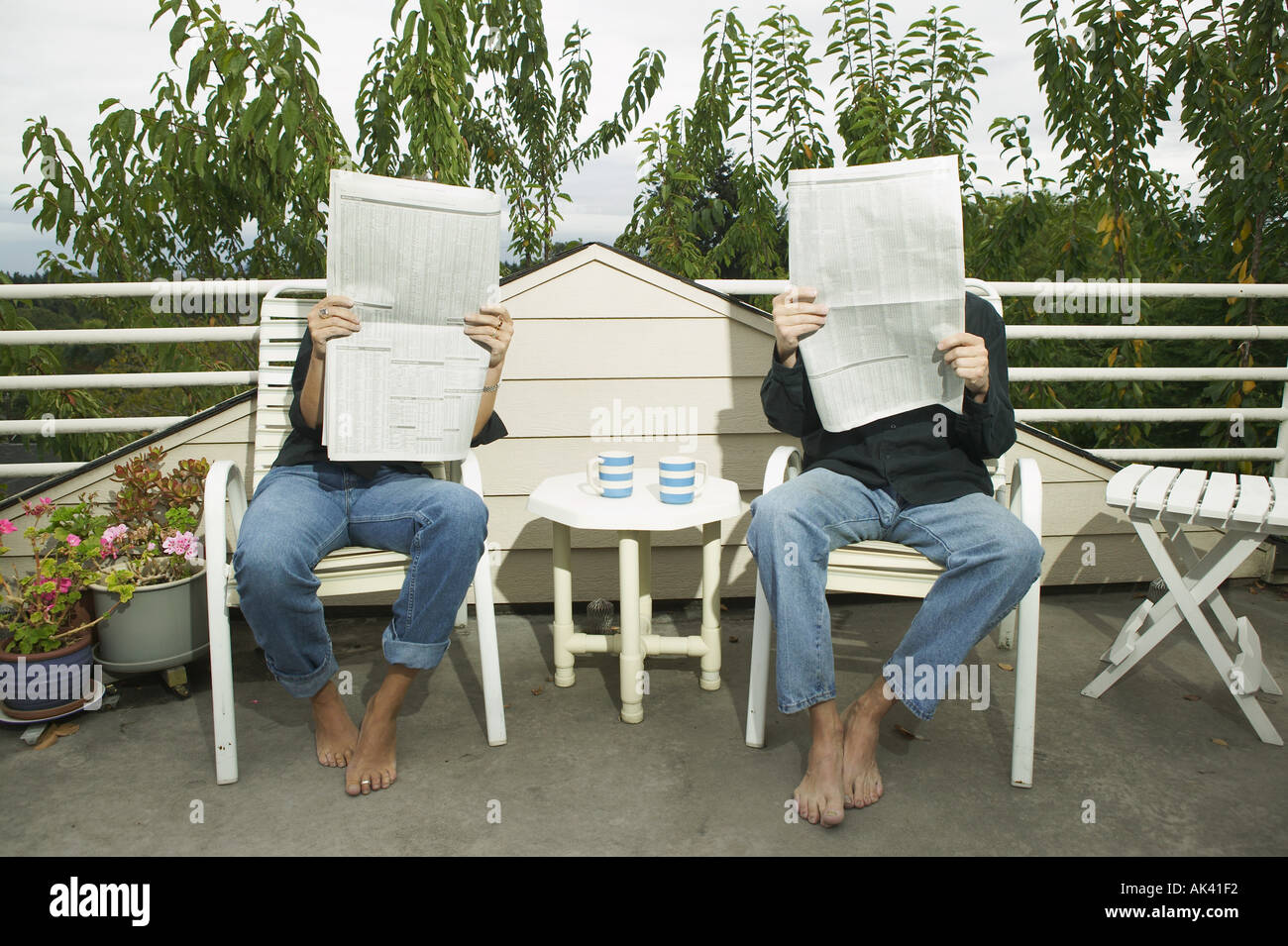 Man reading newspaper on porch hi-res stock photography and images - Alamy