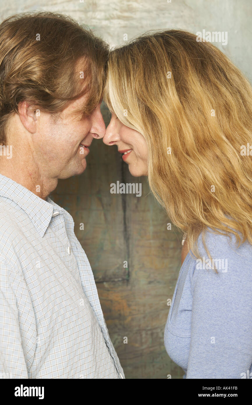 A couple with their foreheads together Stock Photo - Alamy