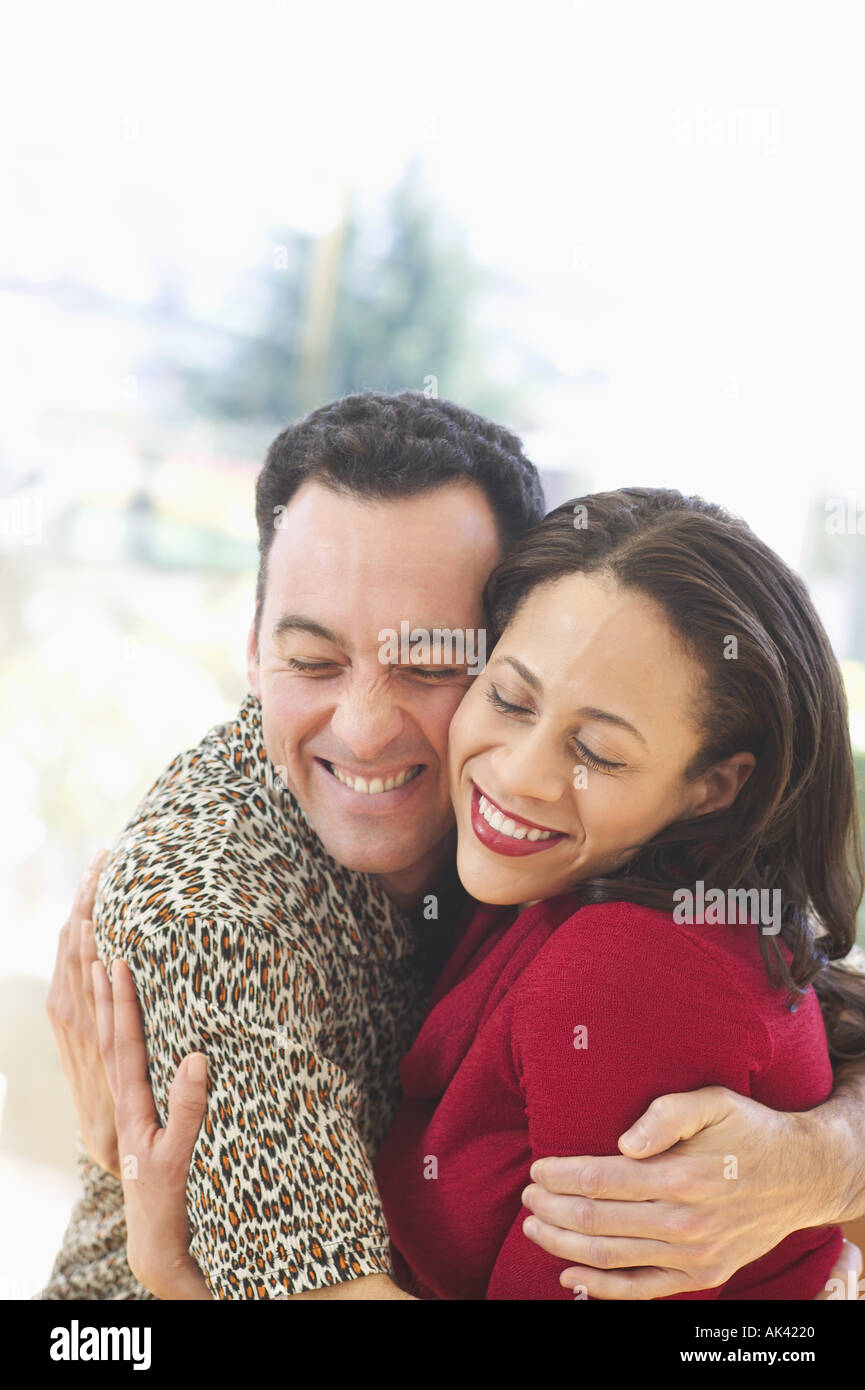 A couple sharing a hug Stock Photo - Alamy