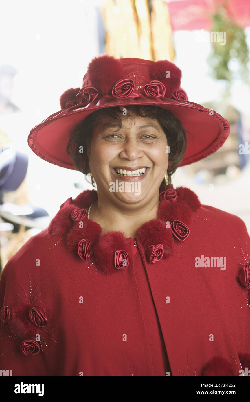 Portrait of a senior woman wearing a fancy red hat Stock Photo - Alamy