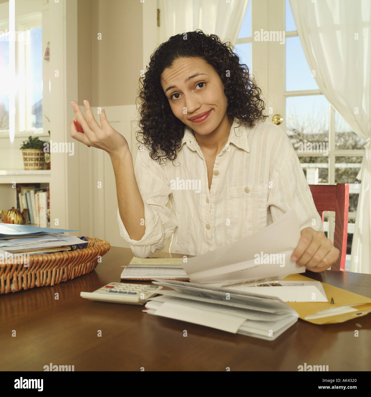 Checkbook on stack of bills hi-res stock photography and images - Alamy