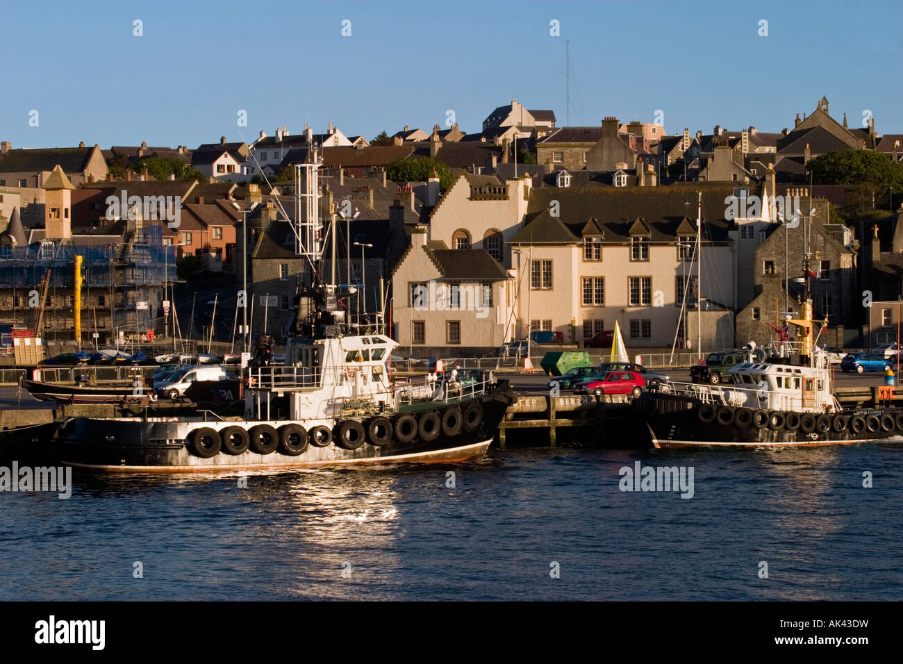 Lerwick harbour with a tug vessel Stock Photo - Alamy