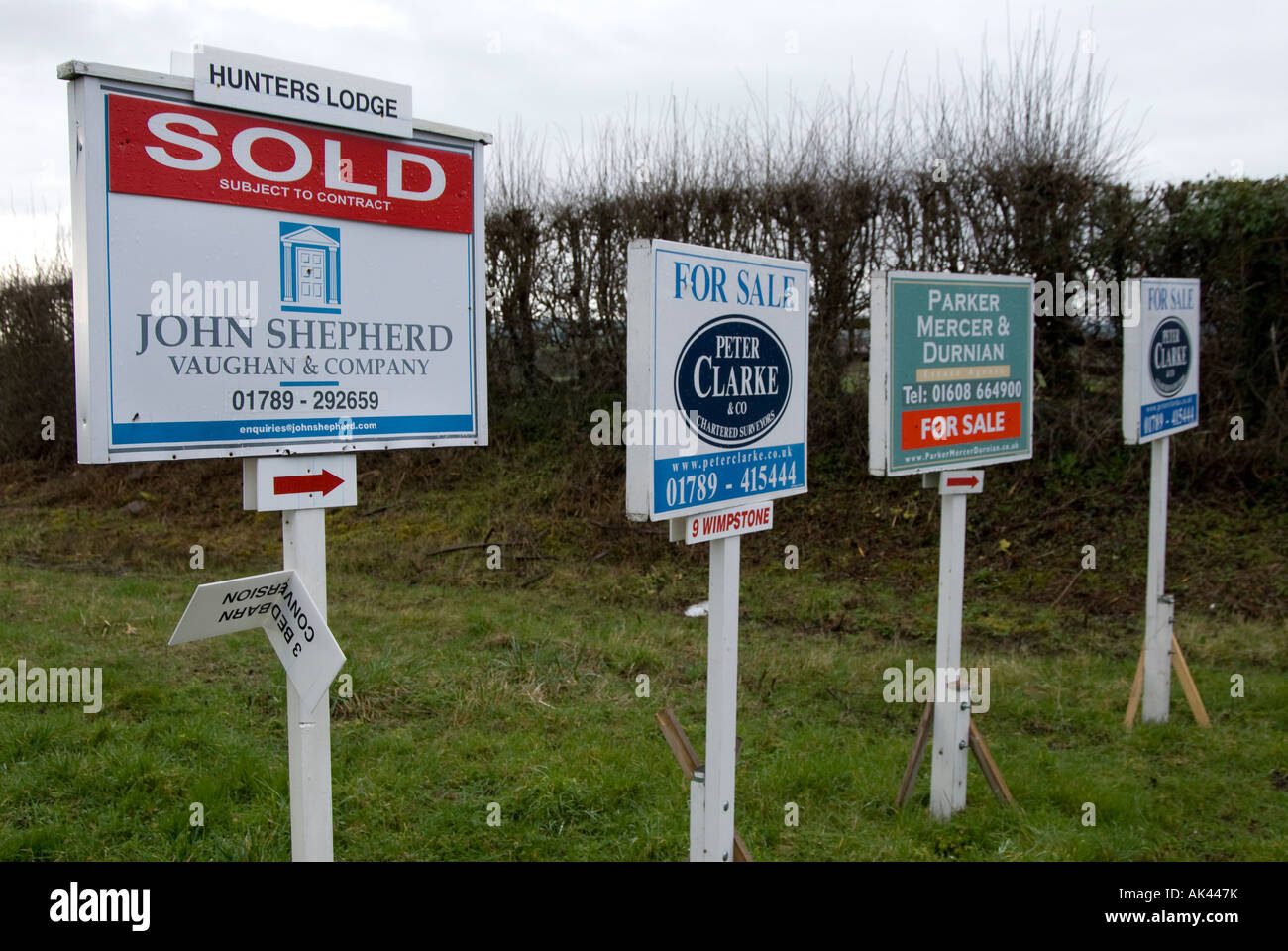 Estate agents sale boards on roadside in the country Stock Photo - Alamy