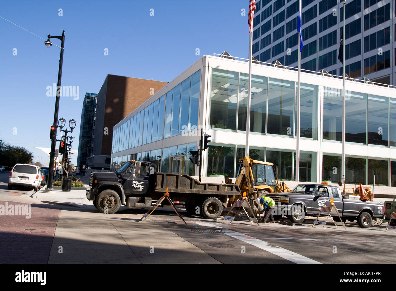 Construction workers digging on a busy street Stock Photo - Alamy