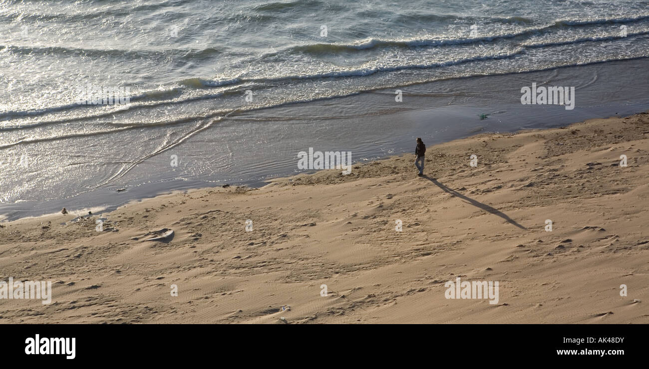 Figure on beach Stock Photo - Alamy