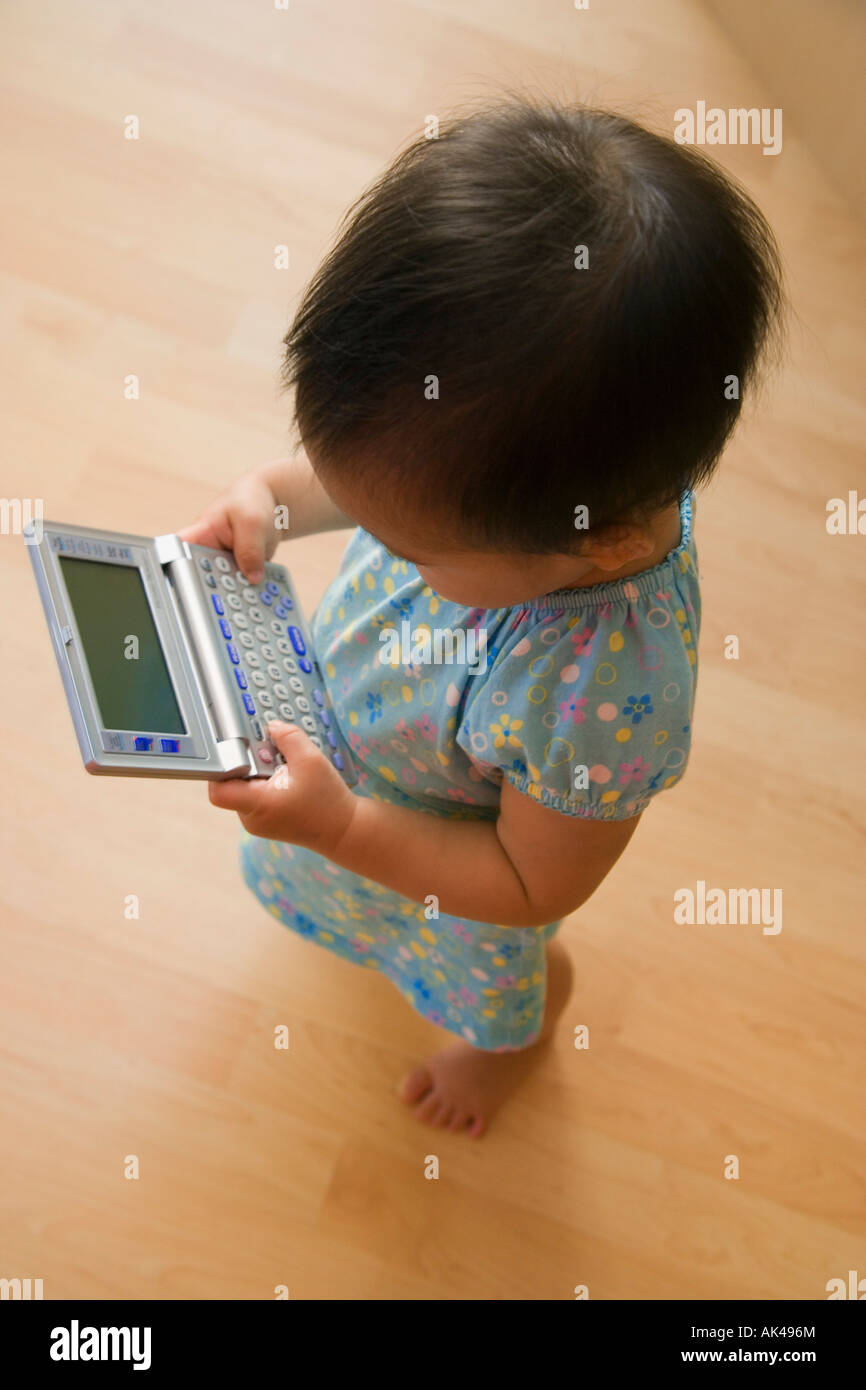 Child playing with a computer Stock Photo - Alamy