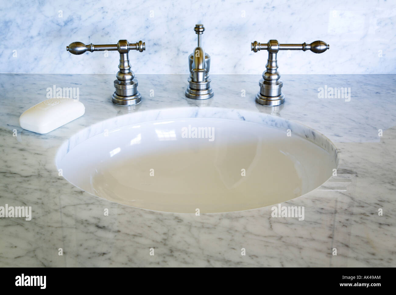 Marble Countertop with Chrome Faucet and Bar of Soap Stock Photo - Alamy