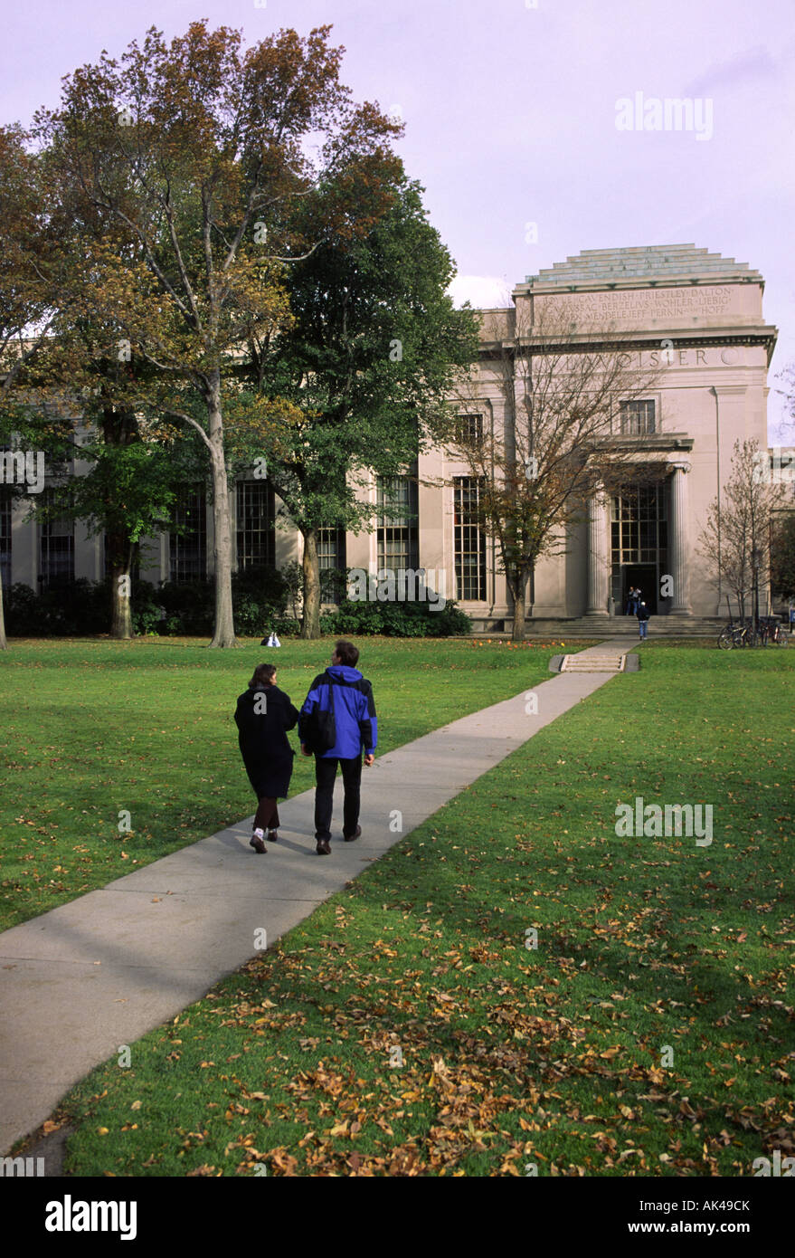 A man and a woman walk on the campus of the Massachusetts Institute of ...