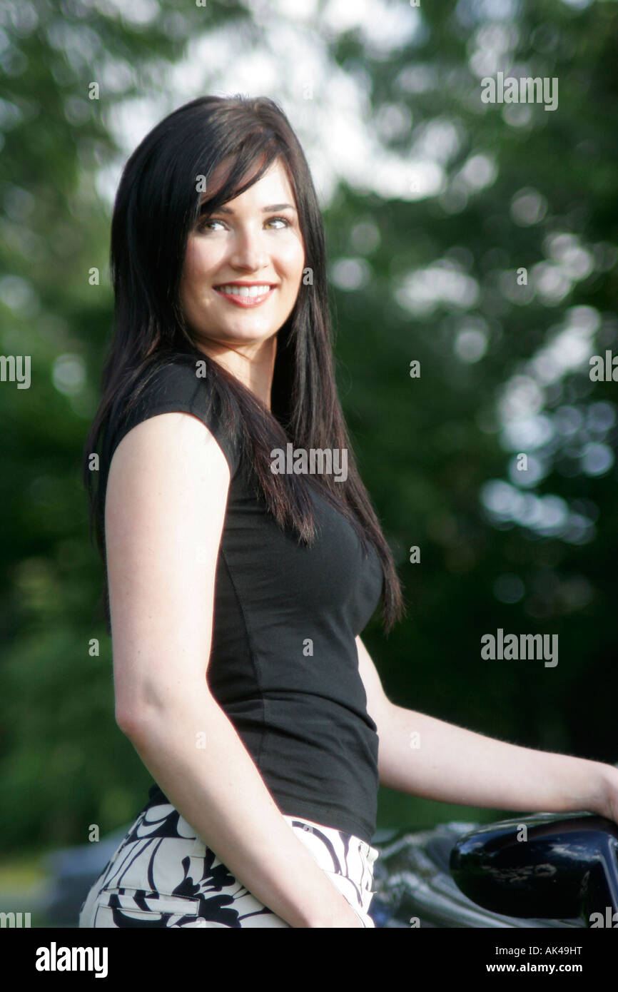 Soft focus of a female madel by a car in summer Stock Photo - Alamy