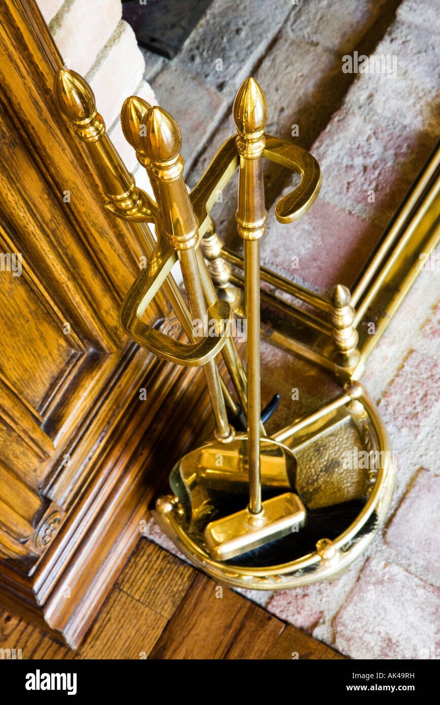 Brass Bucket of Fire Utensils Stock Photo - Alamy