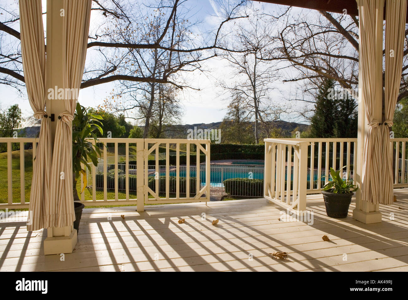 Traditional Back Porch Overlooking Pool Stock Photo - Alamy