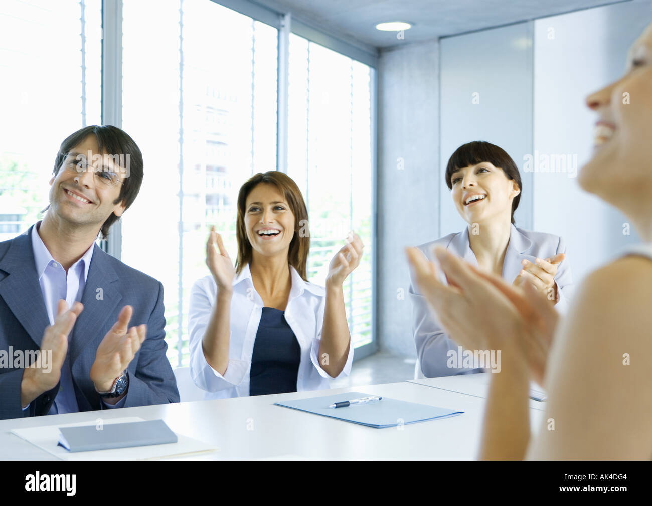 Business team clapping in meeting Stock Photo - Alamy
