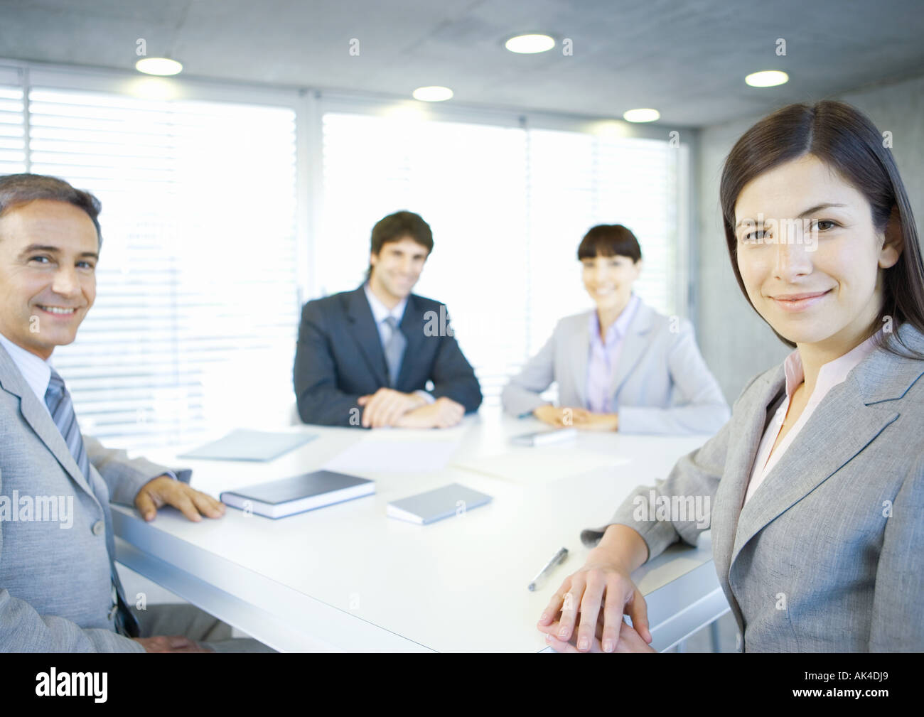 Executives sitting around conference table hi-res stock photography and ...