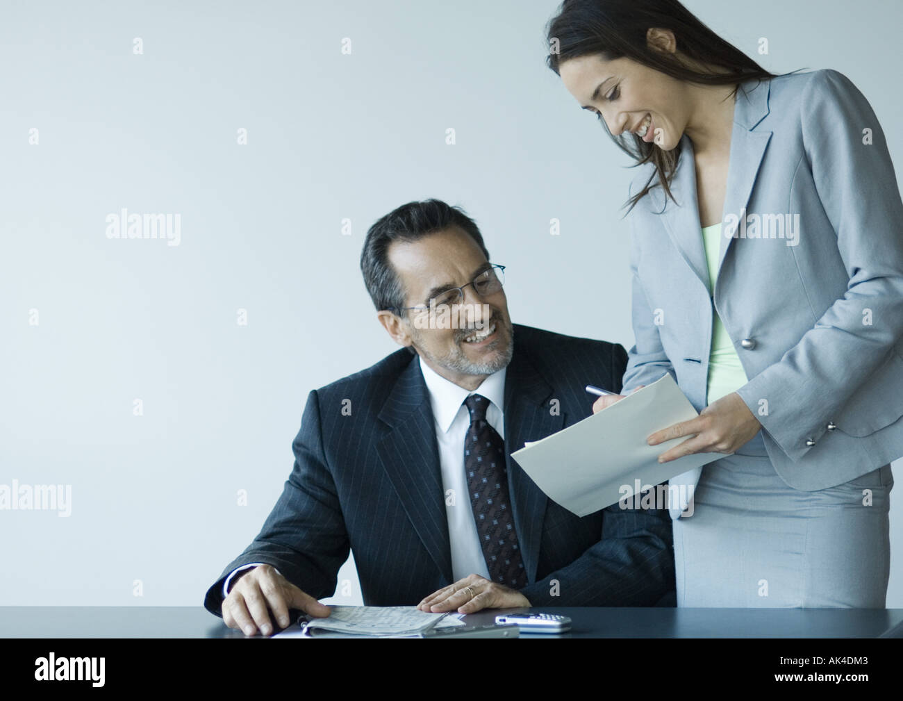 Business colleagues working together, smiling Stock Photo - Alamy