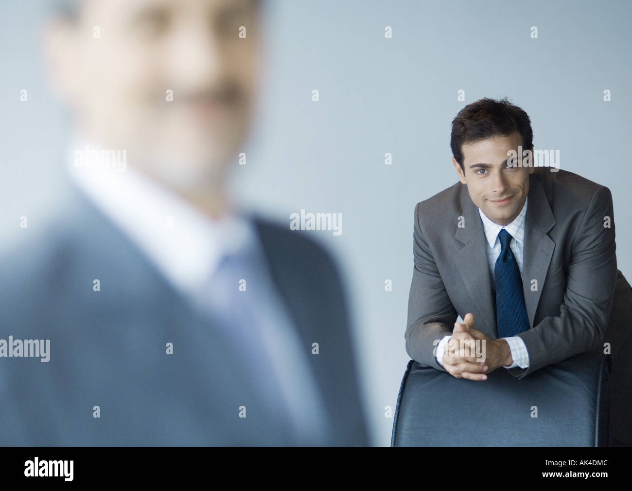 Businessman lean back on chair hi-res stock photography and images - Alamy