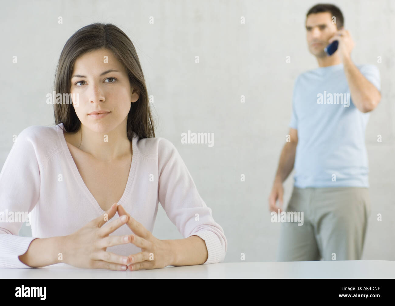 Woman sitting looking camera man hi-res stock photography and images ...
