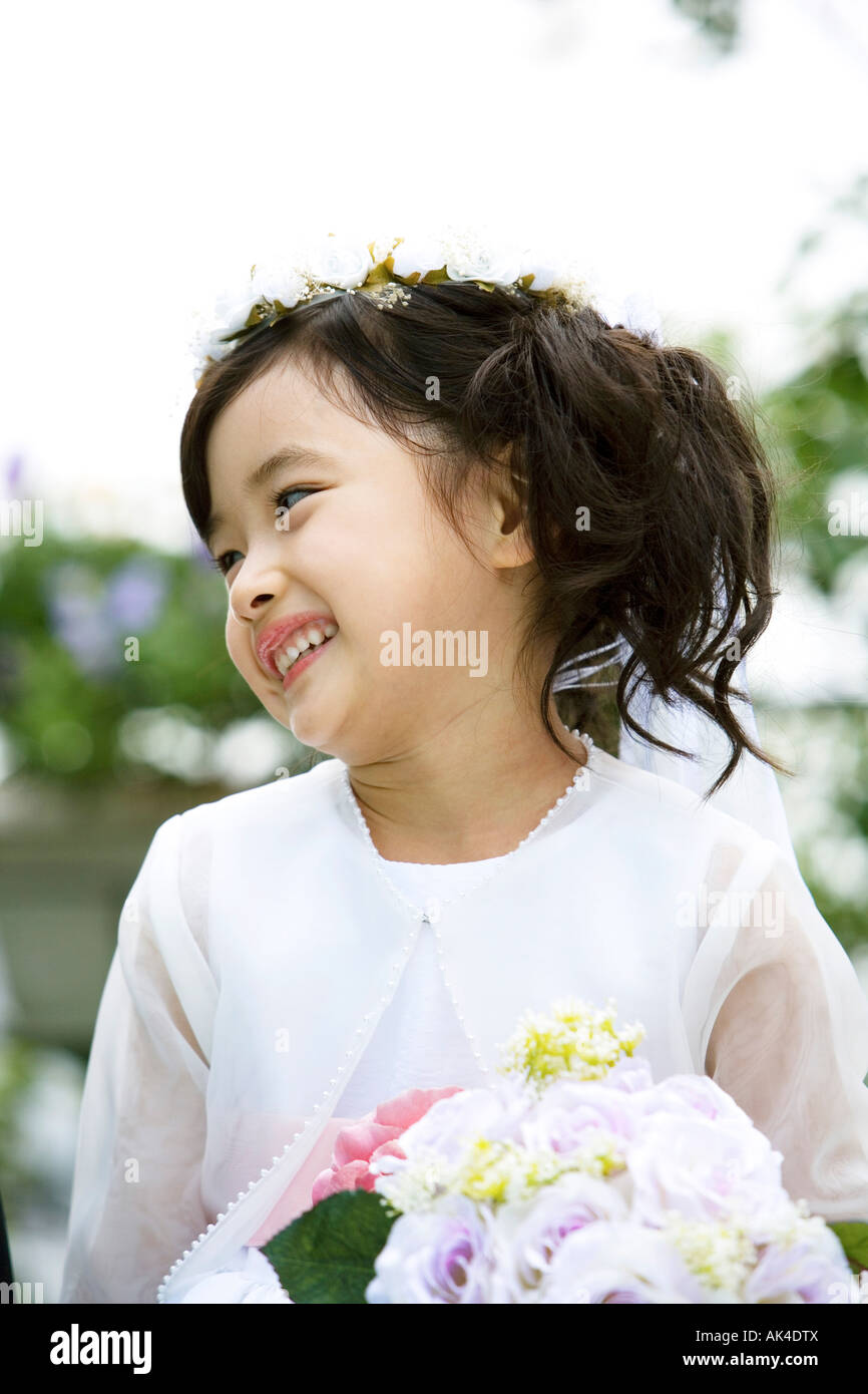 Portrait of flower girl, smiling Stock Photo - Alamy
