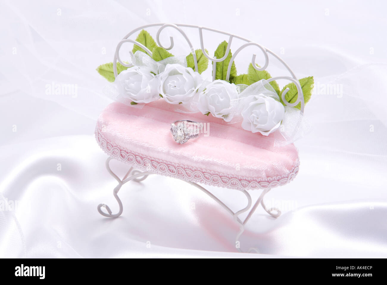 Diamond ring on a miniature chair Stock Photo - Alamy