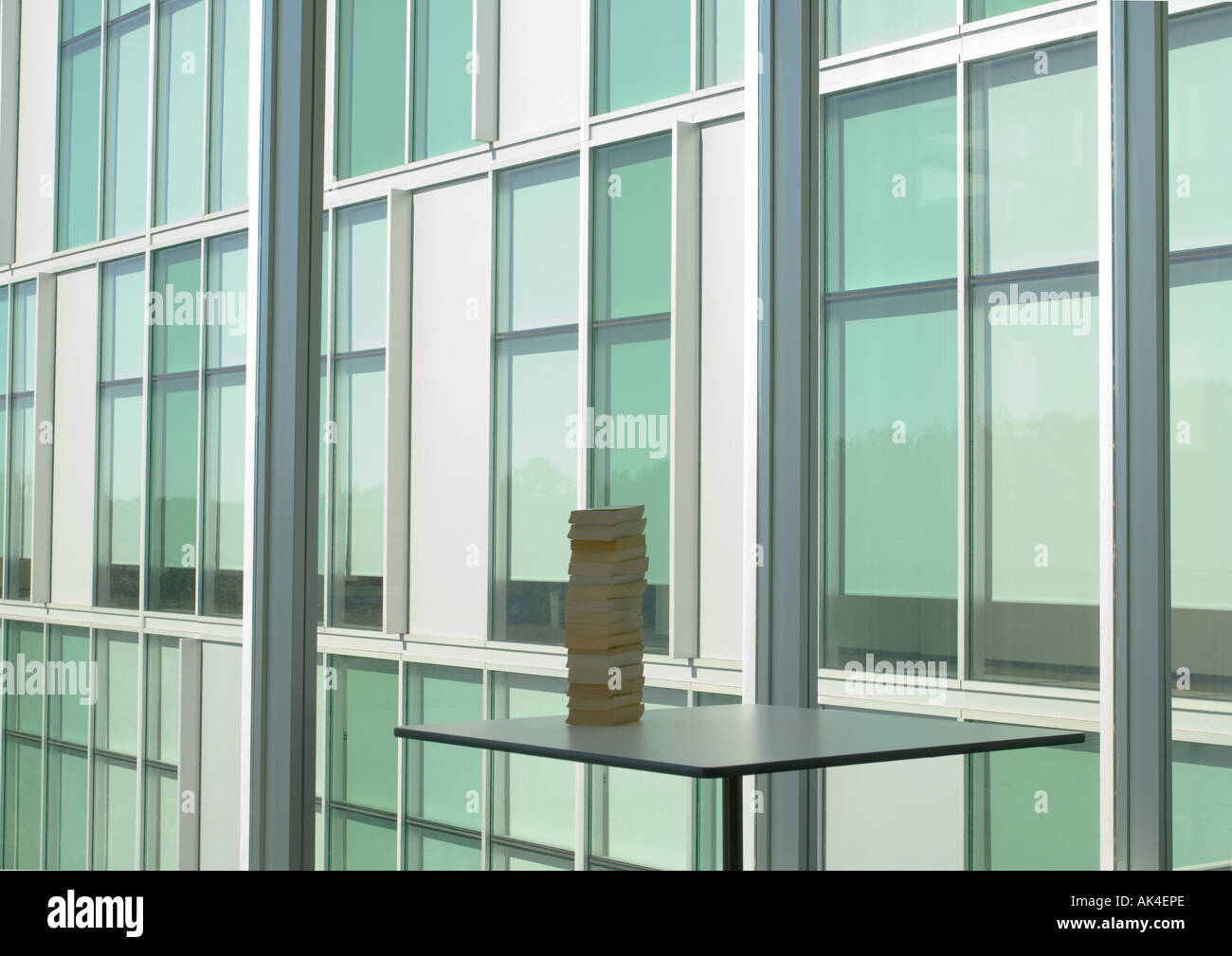 Stack of books and office building facade Stock Photo - Alamy