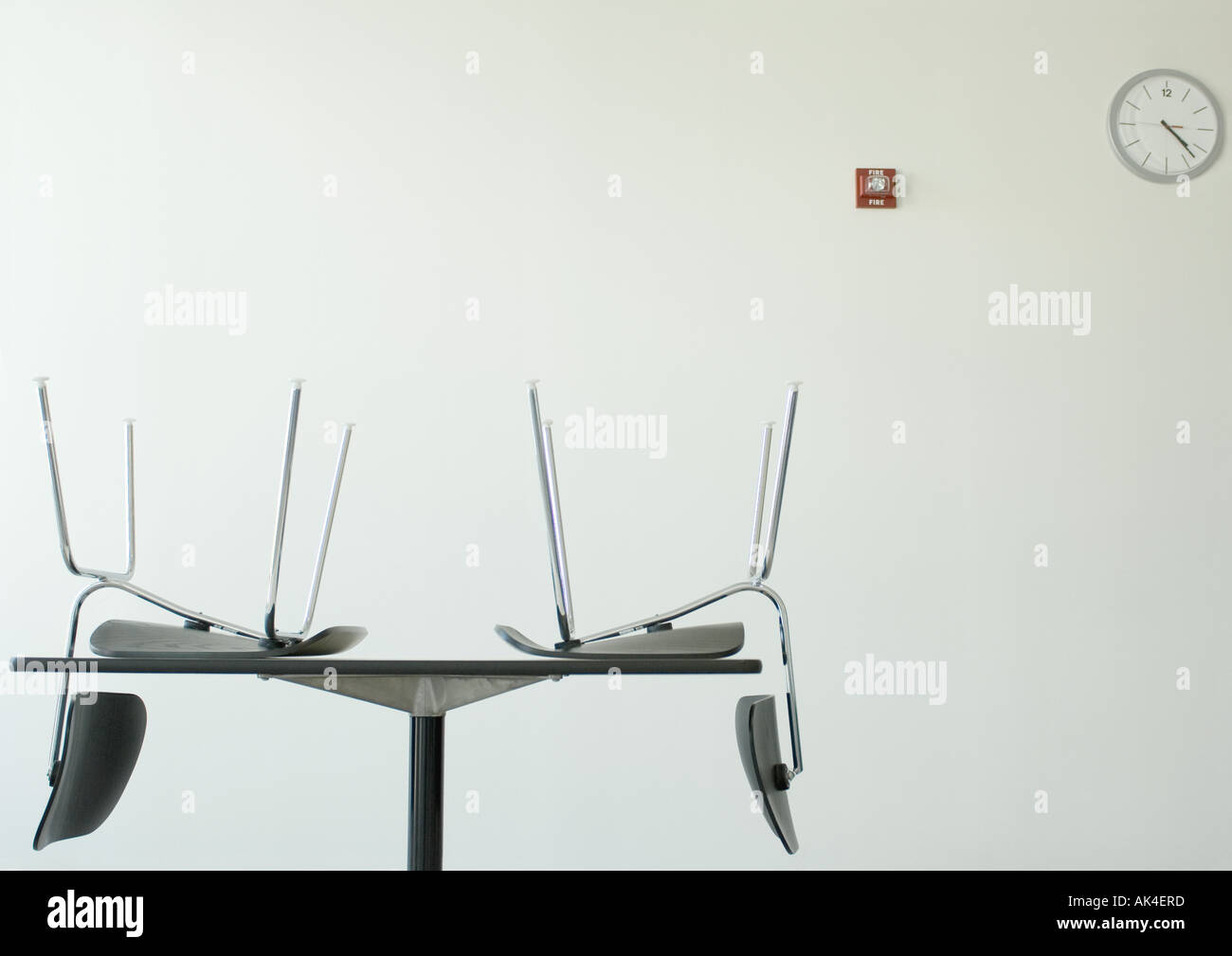 Upside down chairs on table hi-res stock photography and images - Alamy