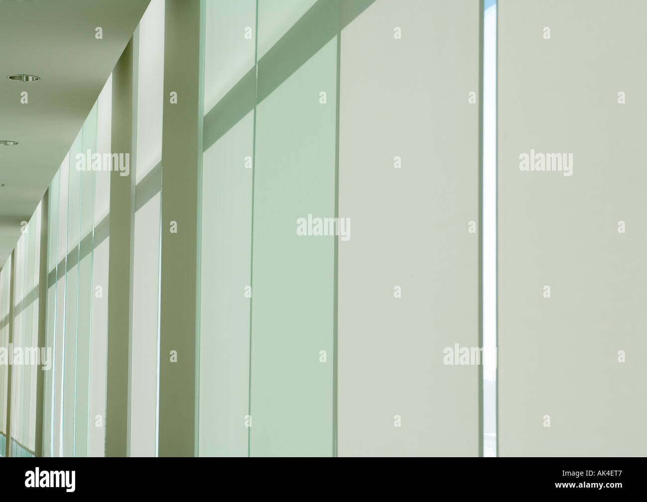 Windows in office building with shades lowered Stock Photo - Alamy