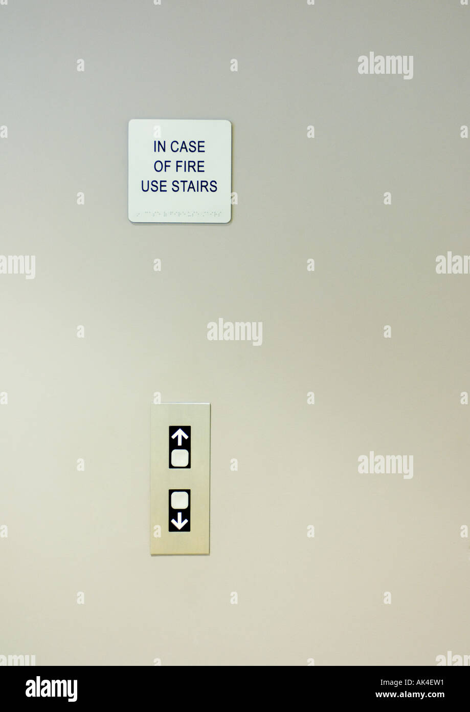 Elevator call buttons and warning sign Stock Photo - Alamy
