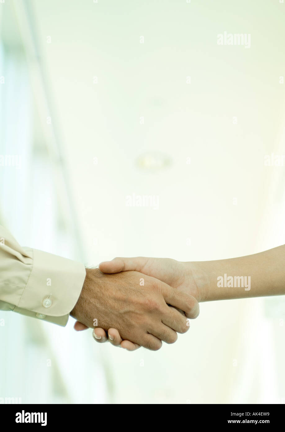Low angle shot shake hands hi-res stock photography and images - Alamy