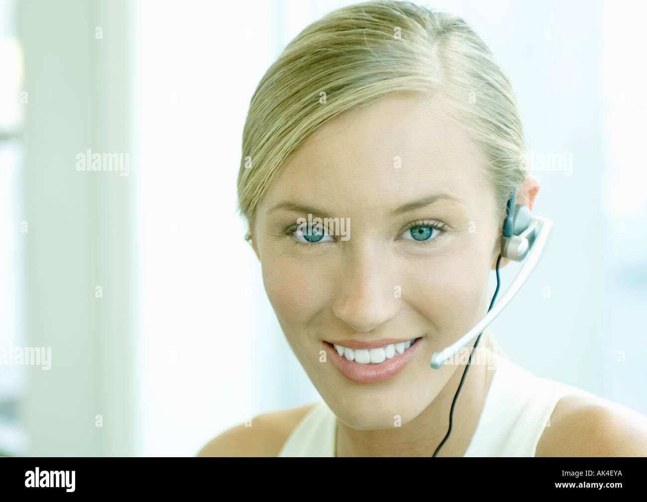 Woman wearing headset Stock Photo - Alamy