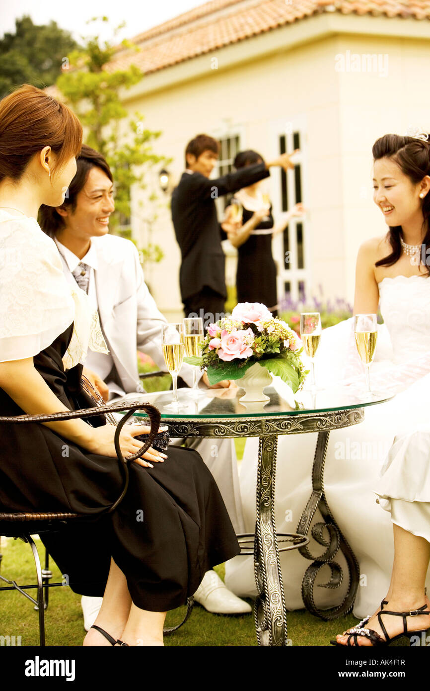 Newlywed couple having fun at their wedding reception Stock Photo - Alamy