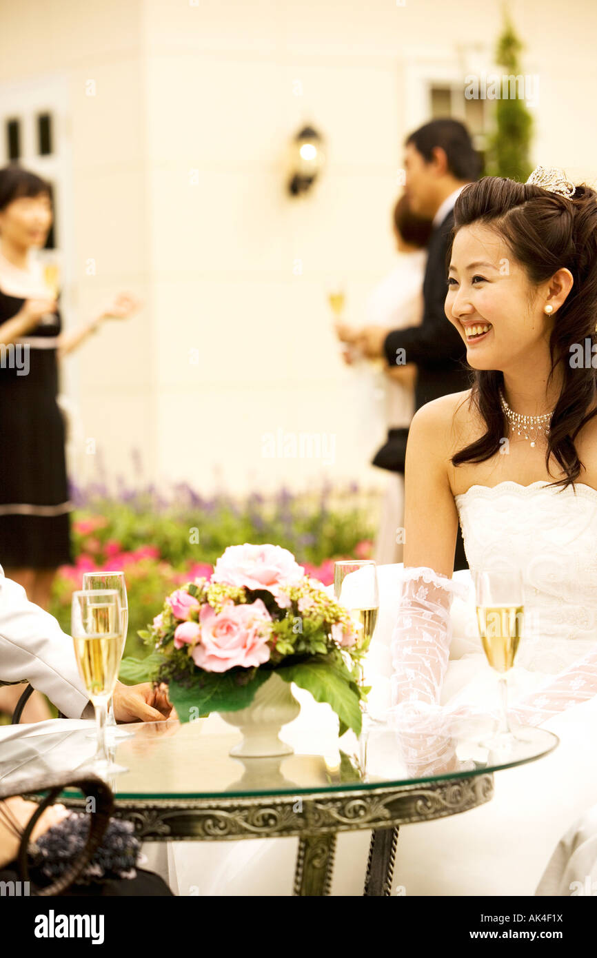 Bride having fun at wedding reception Stock Photo - Alamy