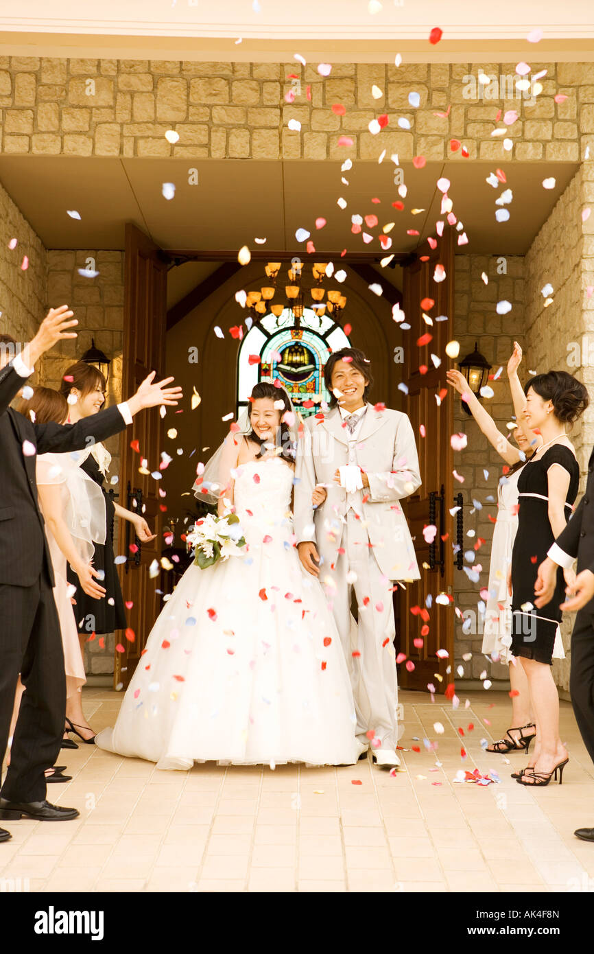 Bride and groom walking out of church hi-res stock photography and ...