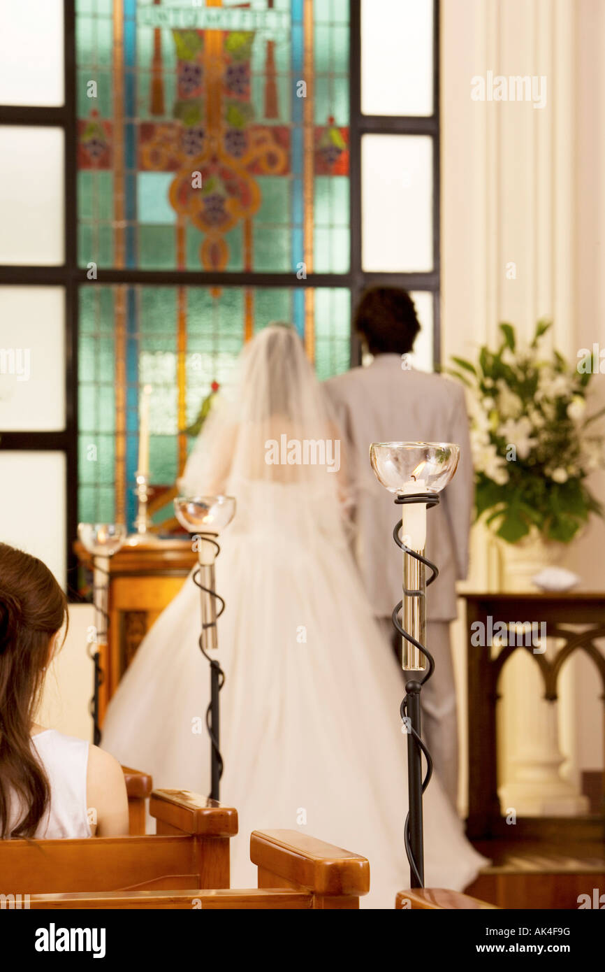 Bride and groom at altar hi-res stock photography and images - Alamy