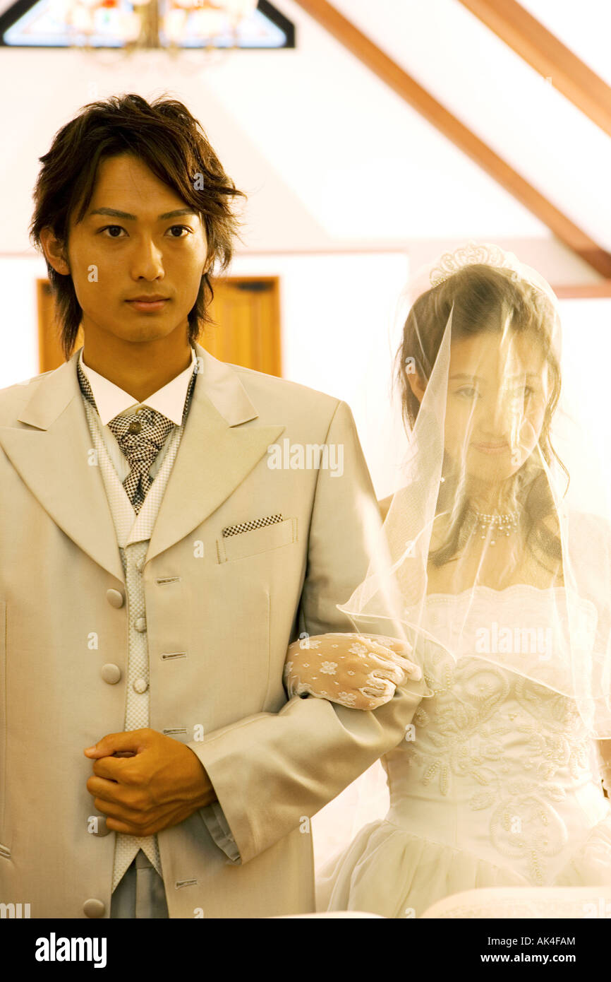 Bride and groom getting married in church Stock Photo - Alamy