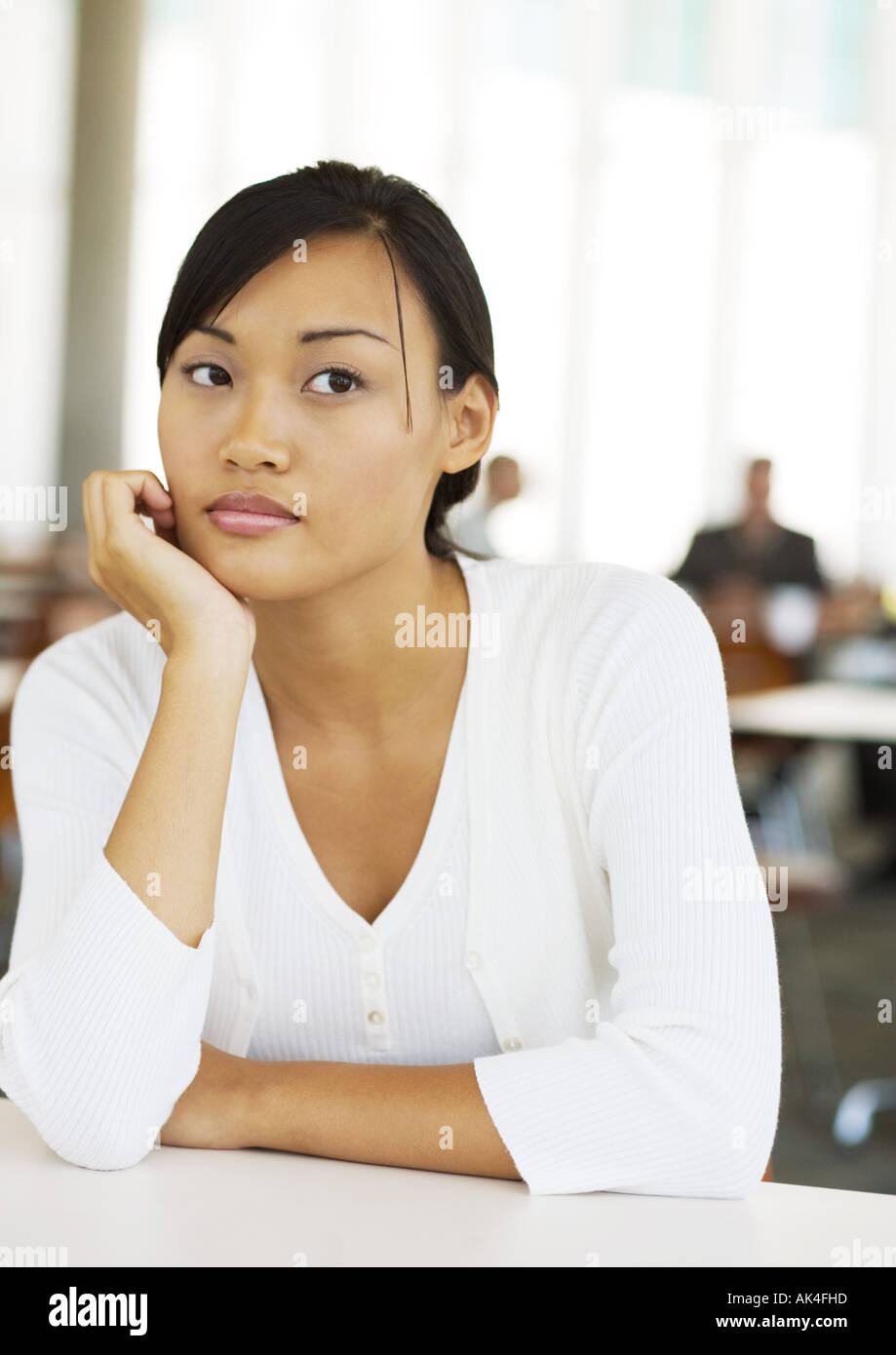 Sitting in corner head in hands hi-res stock photography and images - Alamy