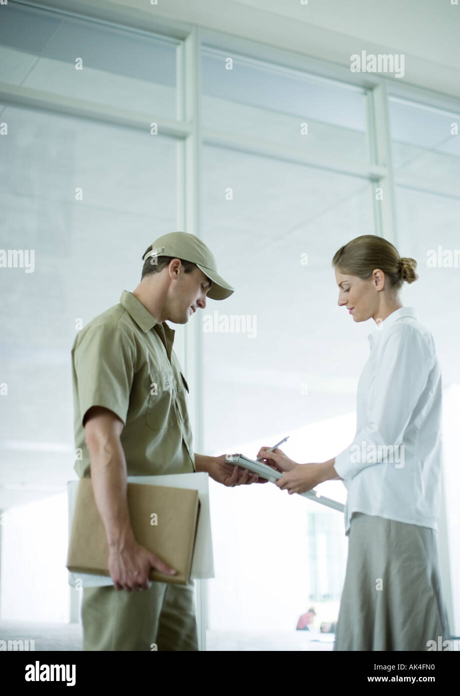 Delivery person's back hi-res stock photography and images - Alamy
