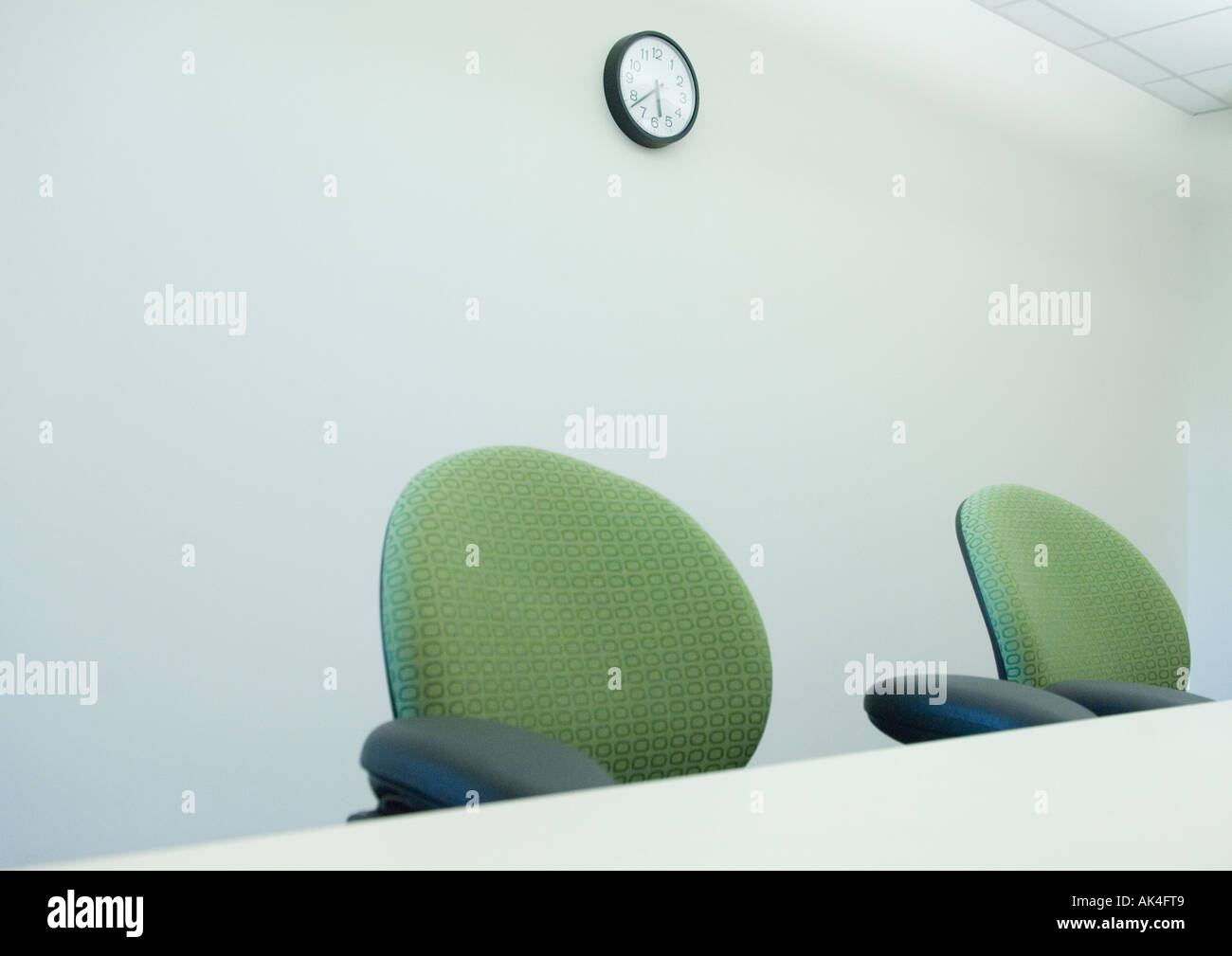 Empty chairs at conference table Stock Photo - Alamy