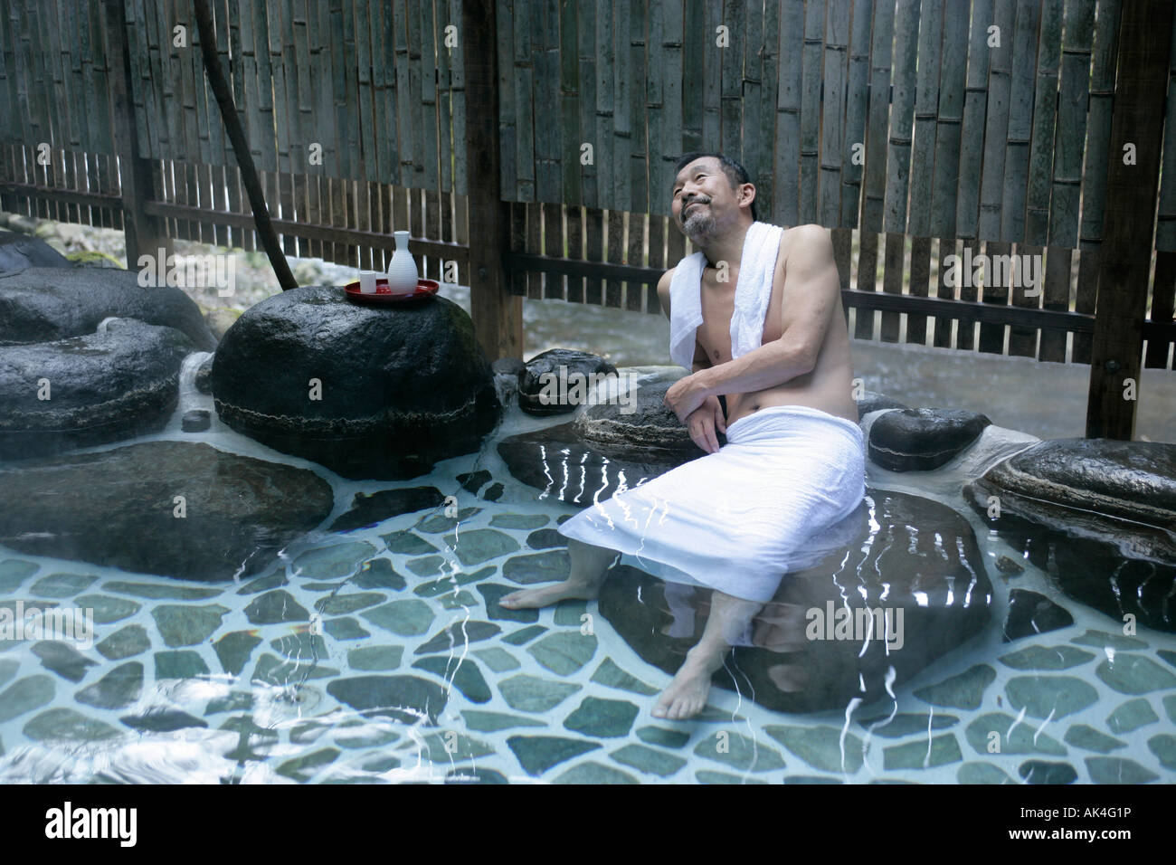 Man in hot spring Stock Photo - Alamy