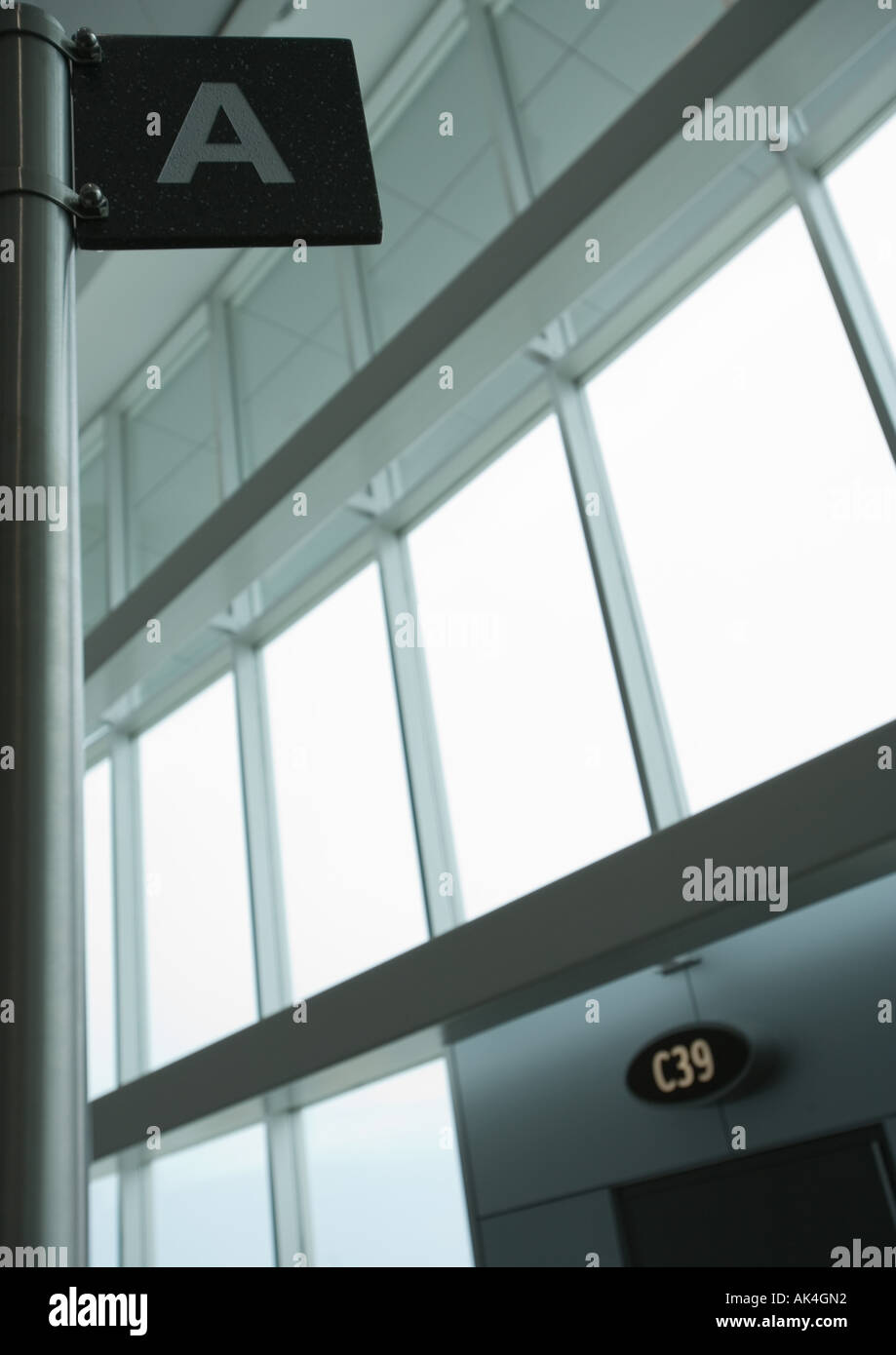 Airport interior: sign with letter "A" and boarding gate Stock Photo ...