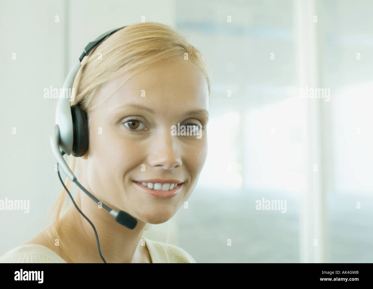 Woman wearing headset Stock Photo - Alamy