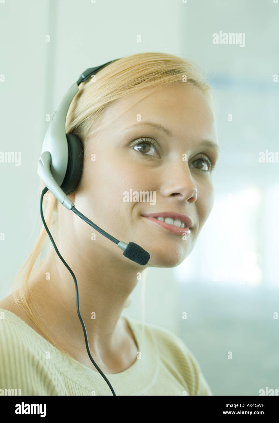 Woman wearing headset Stock Photo - Alamy