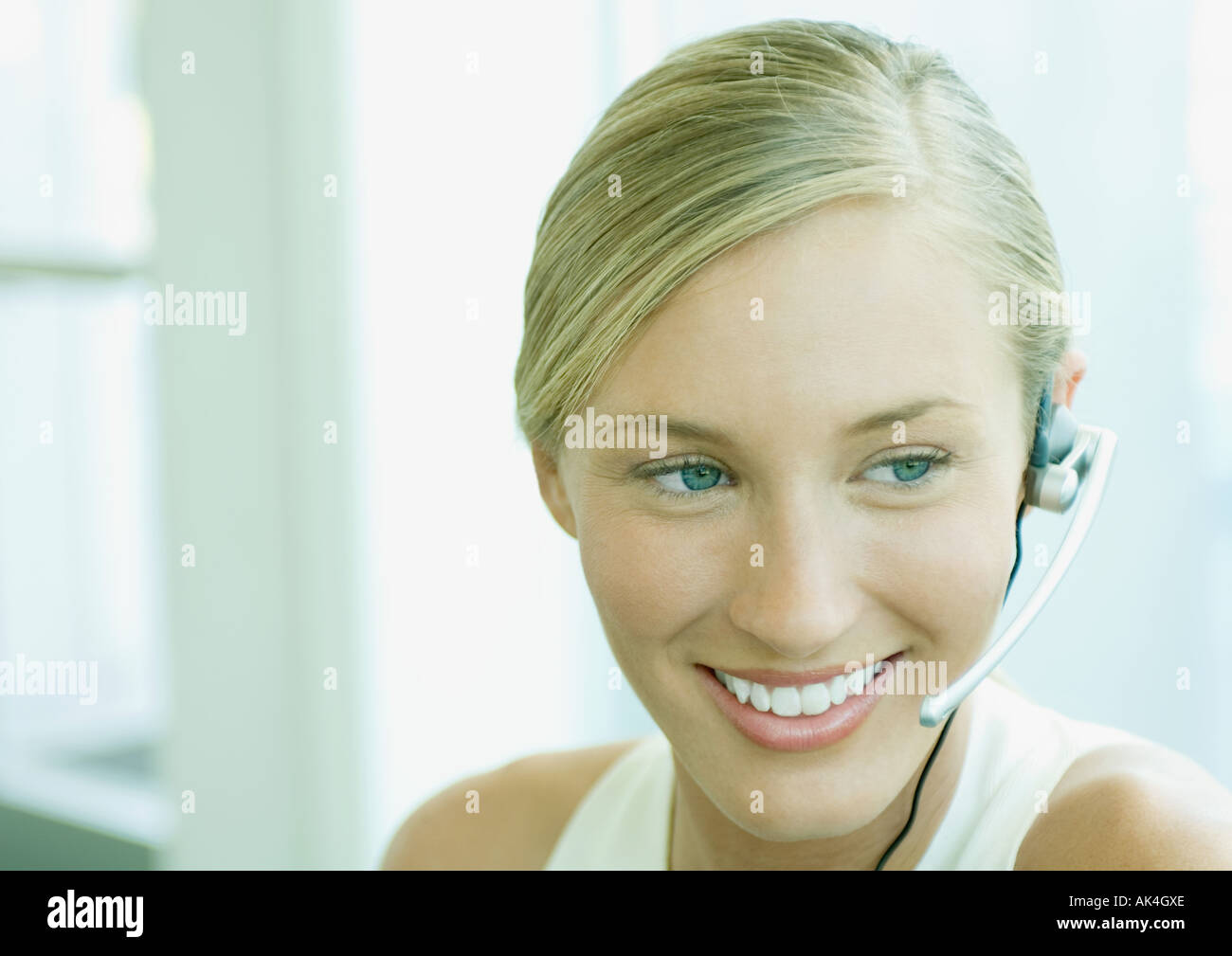 Woman wearing headset Stock Photo - Alamy