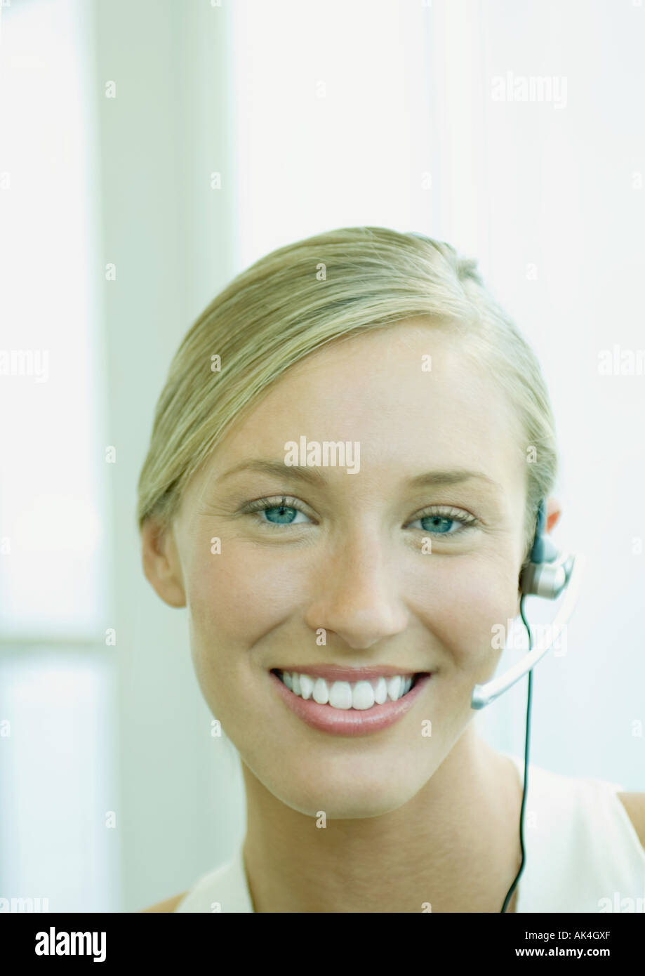 Woman wearing headset Stock Photo - Alamy
