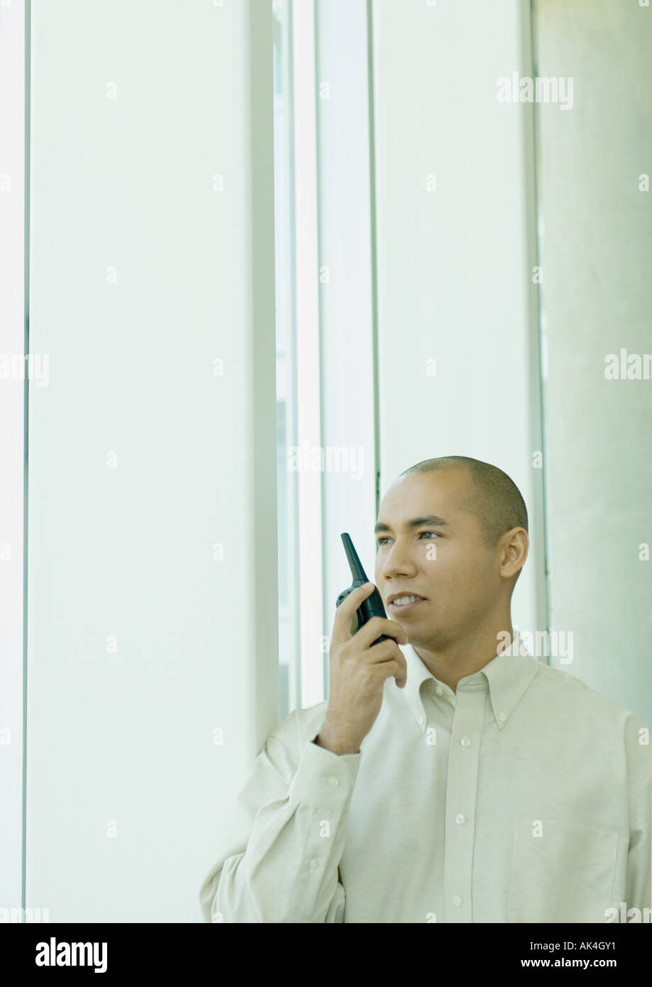 Man using walkie-talkie Stock Photo - Alamy