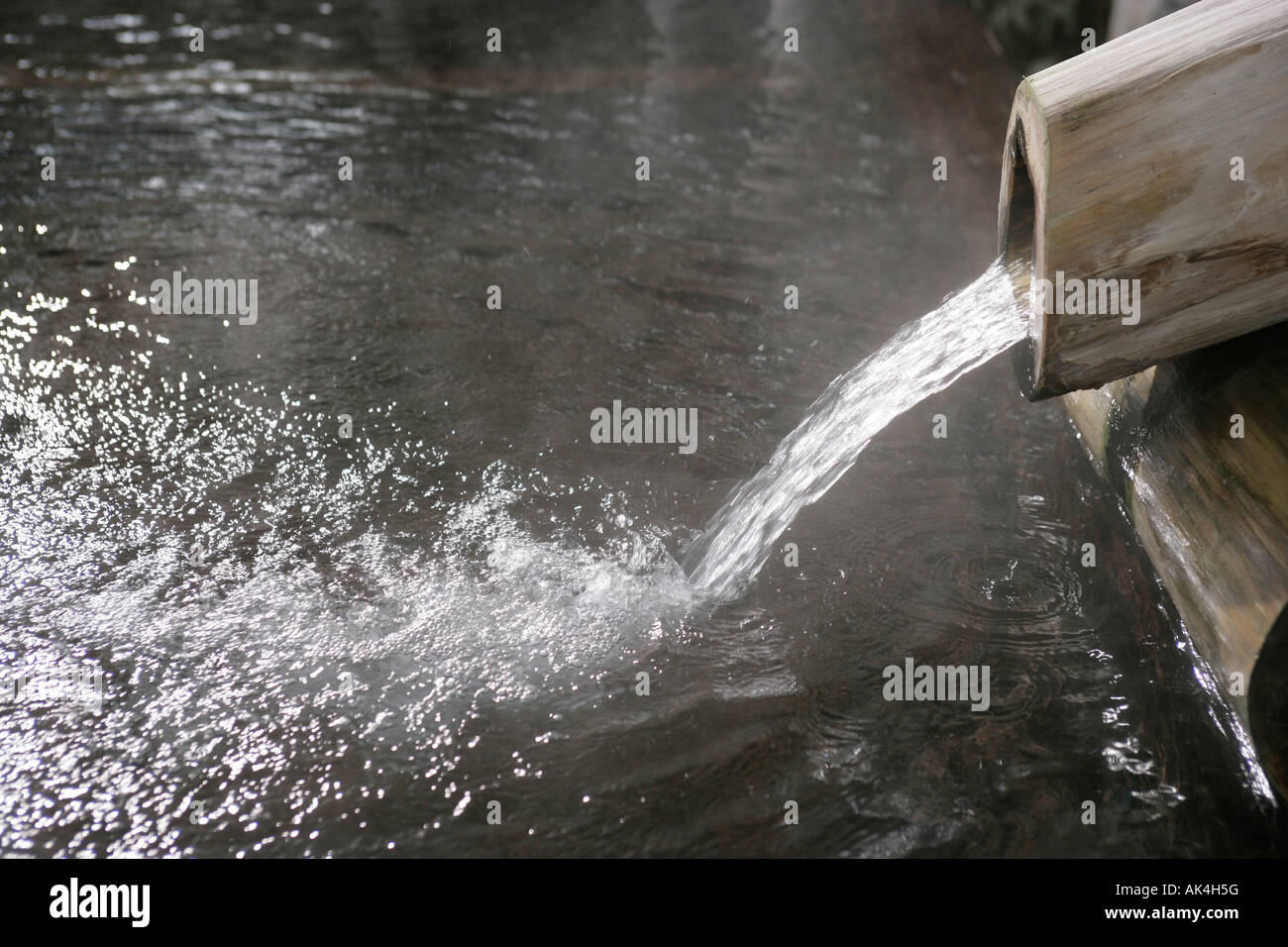 Water flowing out of a wooden pipe Stock Photo - Alamy