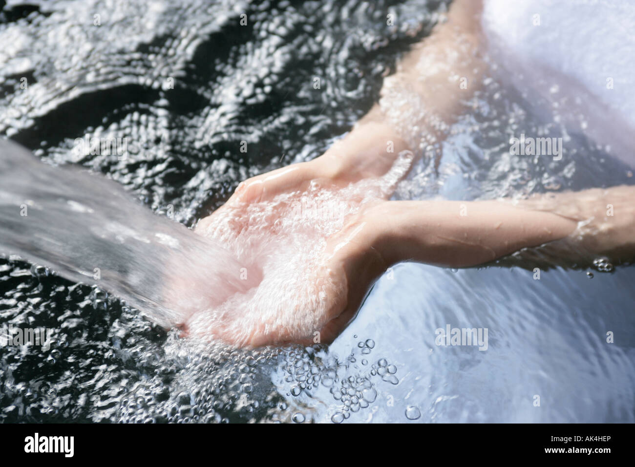 Woman cupping water with her hands Stock Photo - Alamy