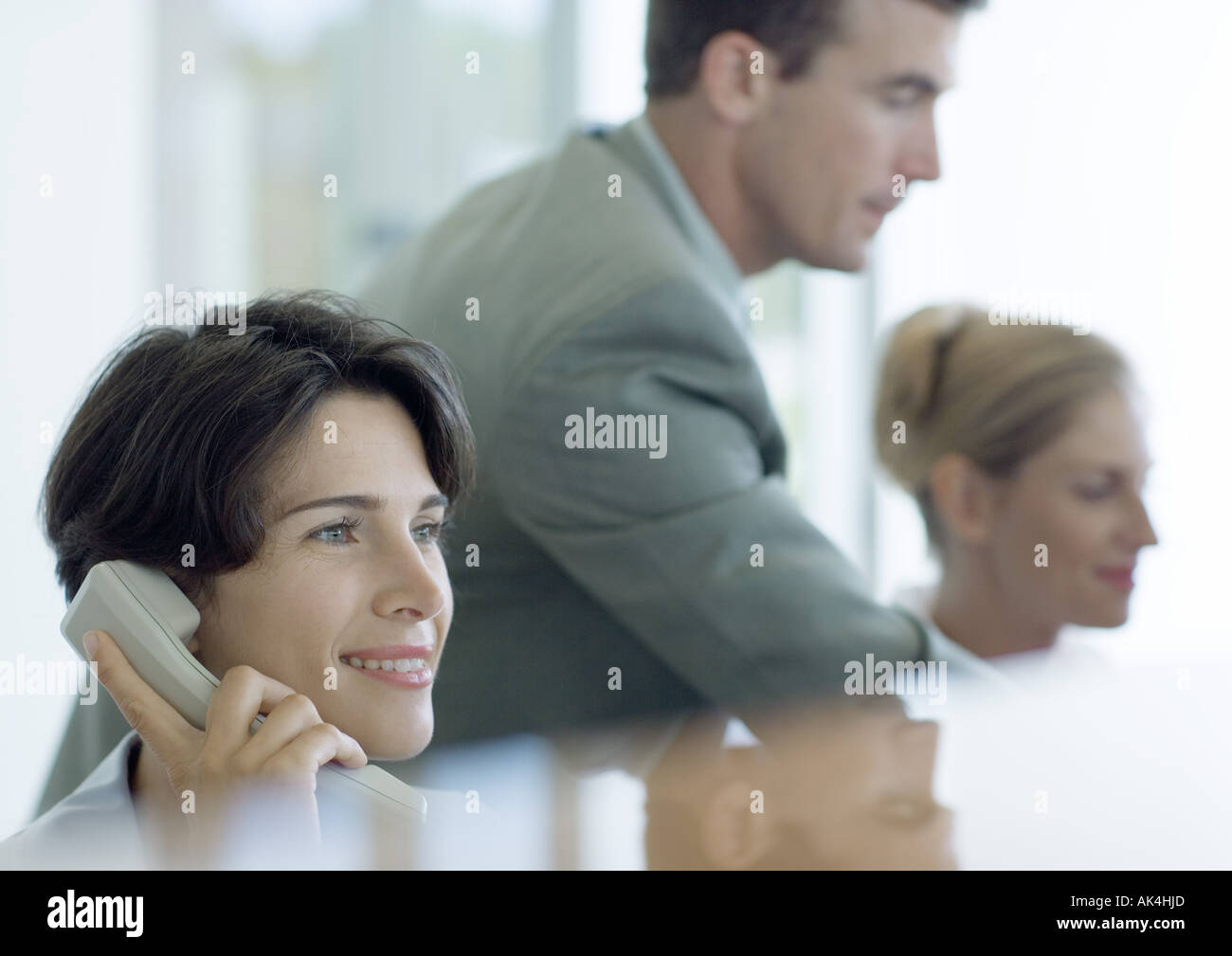 Businessman woman sitting reception desk hi-res stock photography and images - Alamy